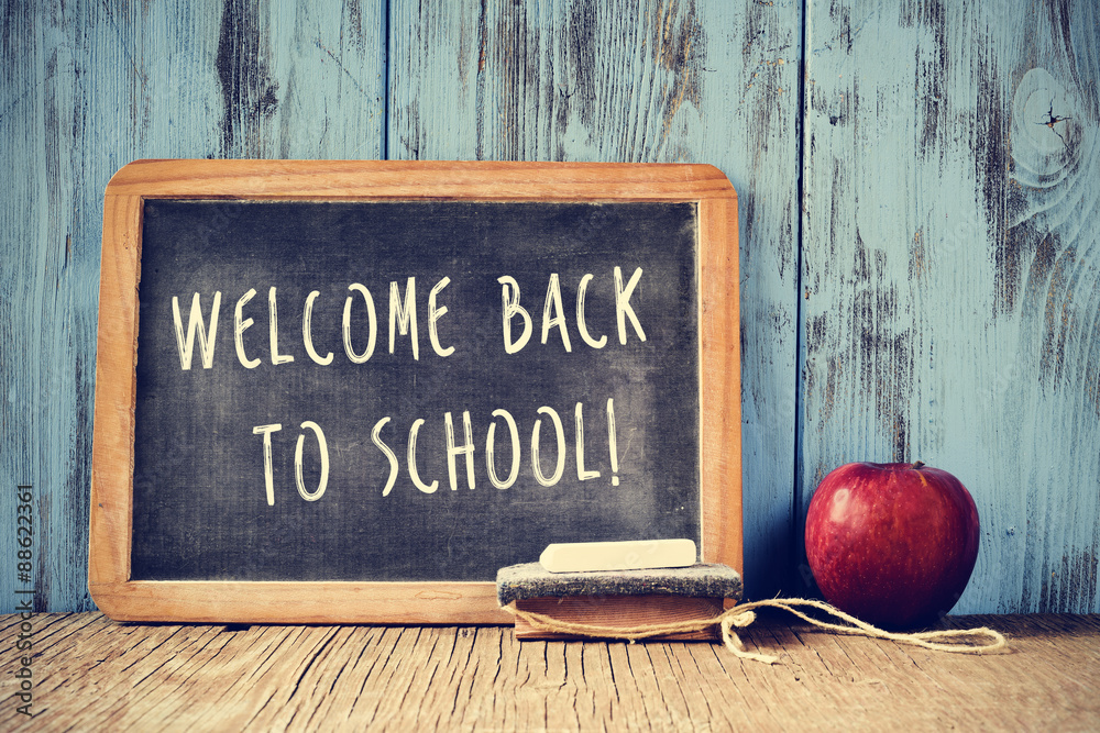 text welcome back to school written on a chalkboard, cross proce Stock ...