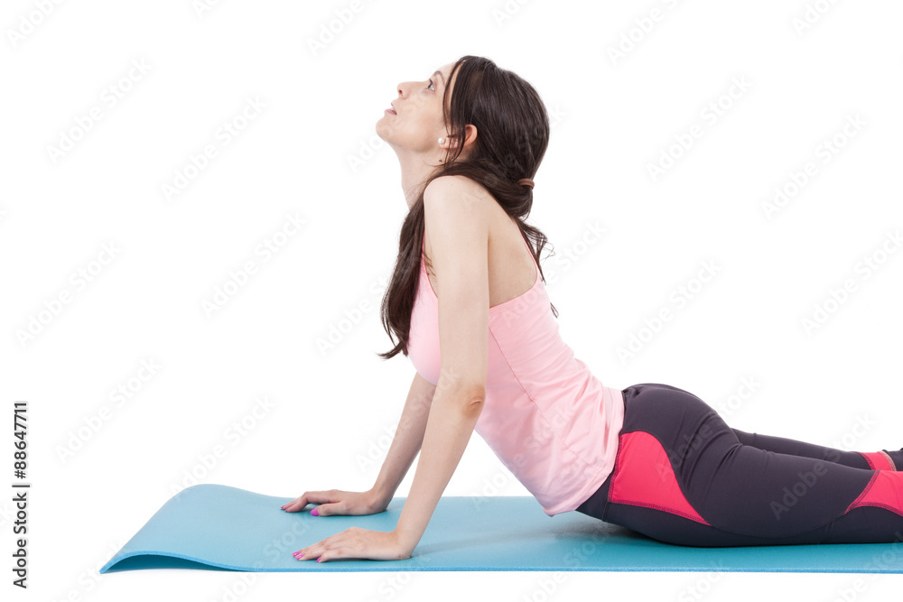 girl on mat doing back exercises Stock Photo | Adobe Stock