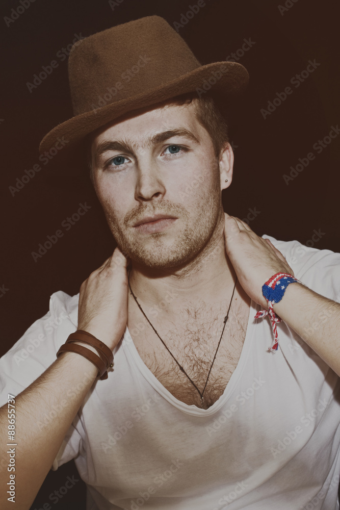 Portrait of young man wearing hat Stock Photo | Adobe Stock