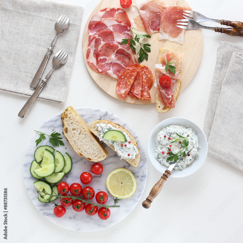 Plate of cold cuts, bread spread and vegetables Stock Photo | Adobe Stock