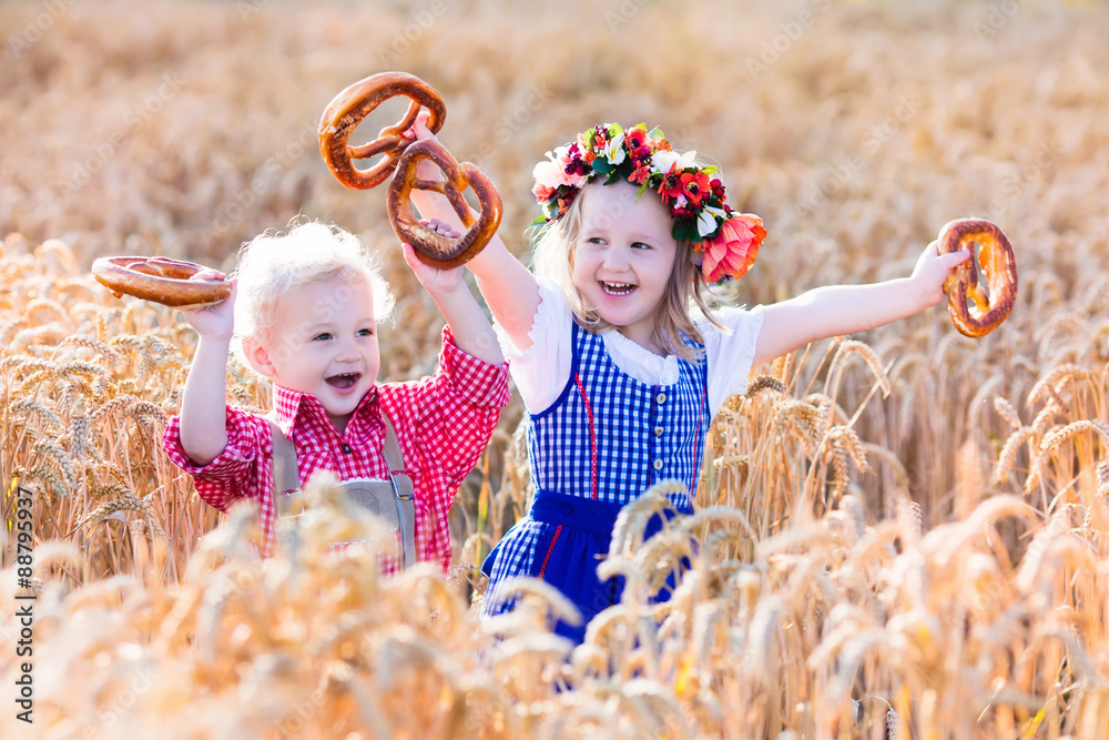 Kids in Bavarian costumes in wheat field Stock Photo | Adobe Stock