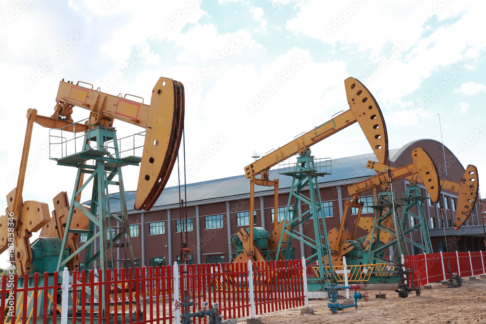Golden yellow Oil pump of crude oilwell rig Stock Photo | Adobe Stock