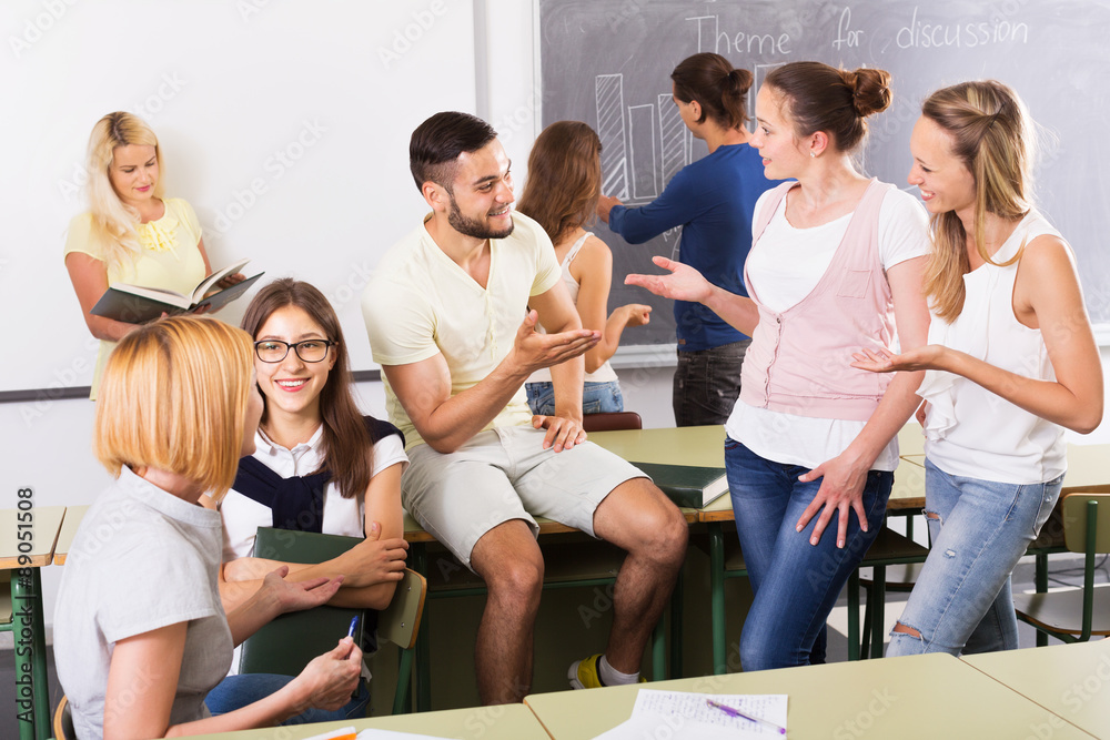 Happy students during break in classroom Stock Photo | Adobe Stock