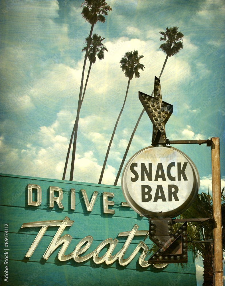Poster aged and worn vintage photo of drive in theater and snack bar ...