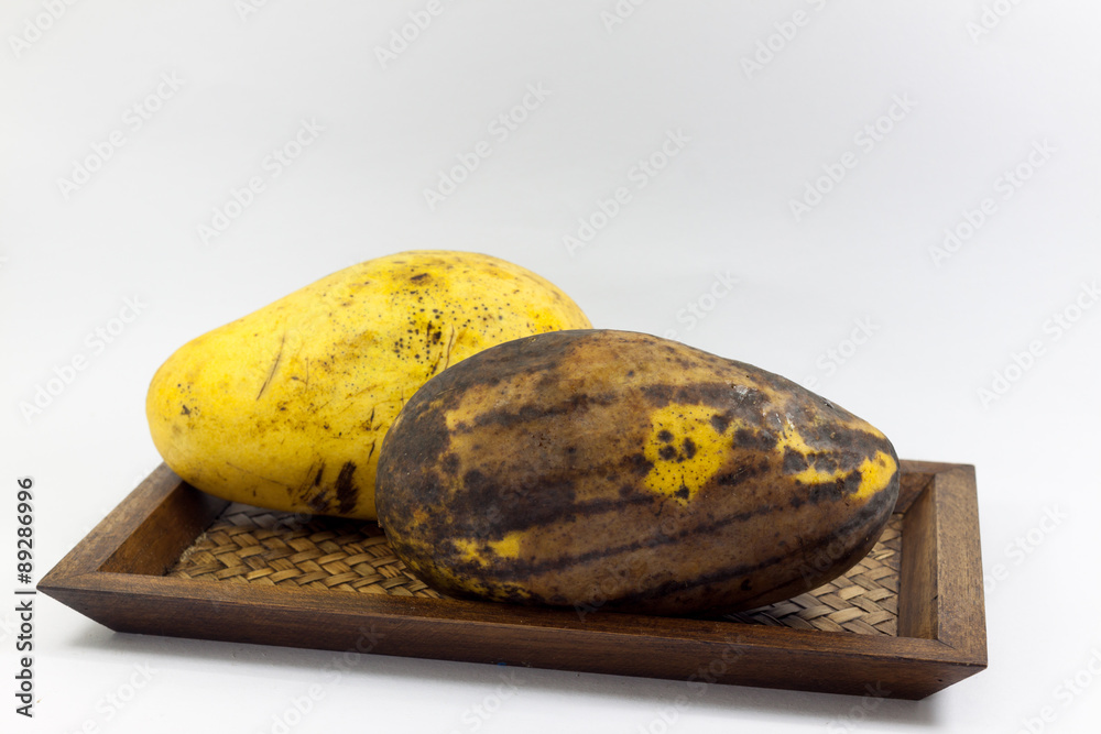 rotten mango with wormholes caused by pest insect (Drosophila ...