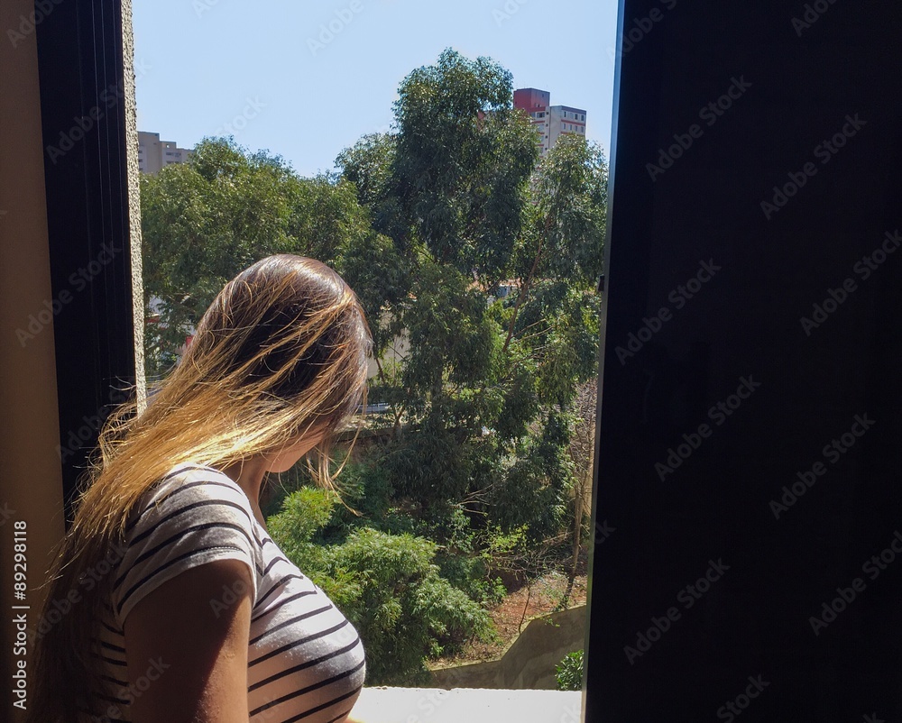 Girl looking out the window Stock Photo | Adobe Stock