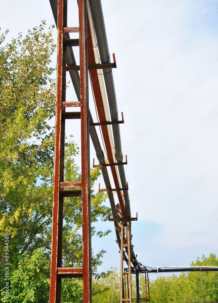 Technical pipes above ground on pylons Stock Photo | Adobe Stock