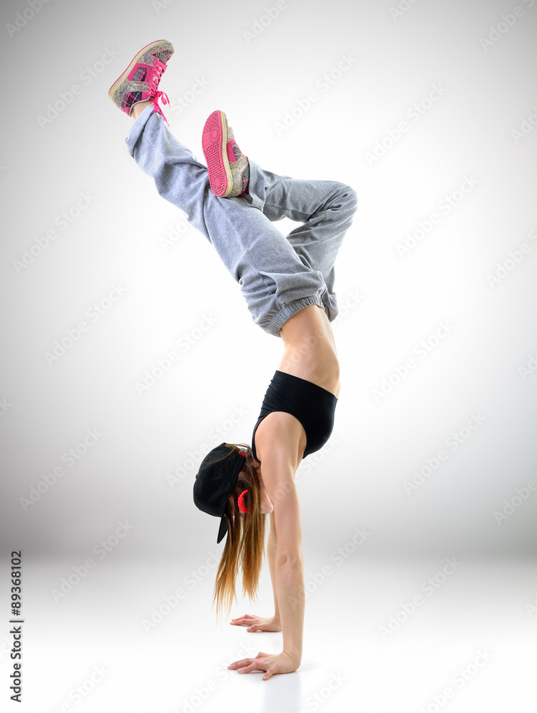 Teen girl hip-hop dancer, studio shot Stock Photo | Adobe Stock