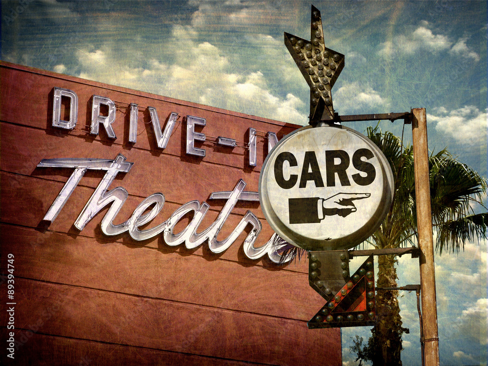 aged and worn vintage photo of neon drive in sign Stock Photo | Adobe Stock