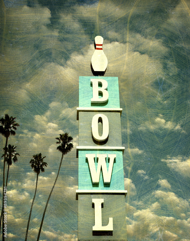aged and worn vintage photo of bowling alley sign with palm trees Stock ...