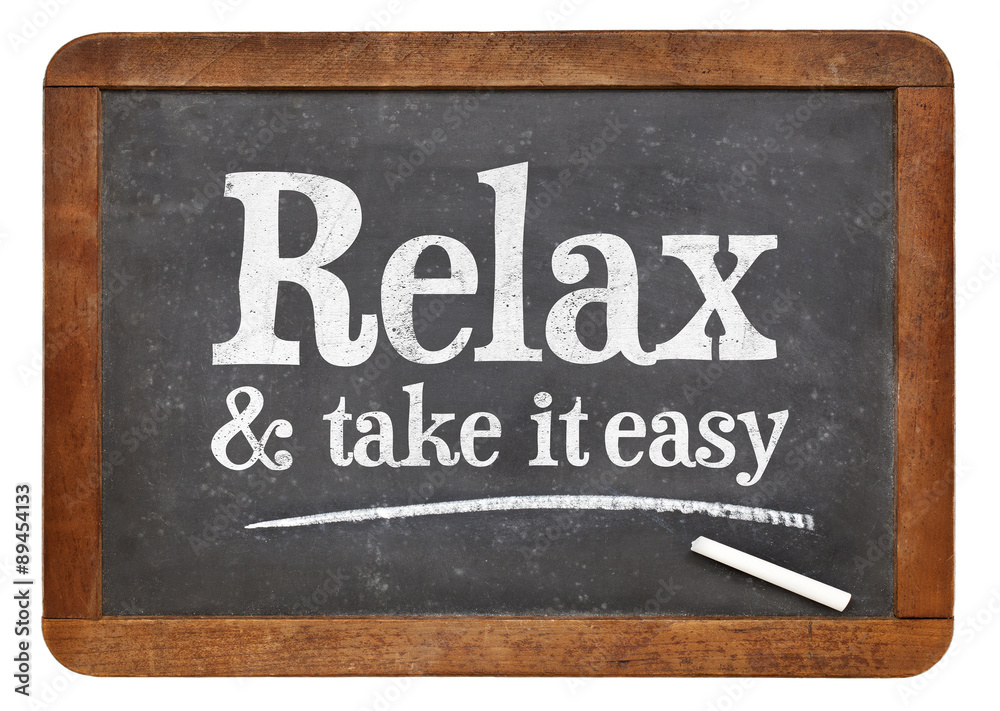 Relax and take it easy - advice on blackboard Stock-Foto | Adobe Stock