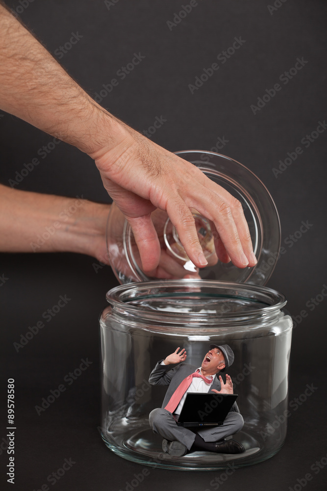 Businessman trapped inside a transparent glass jar Stock Photo | Adobe ...
