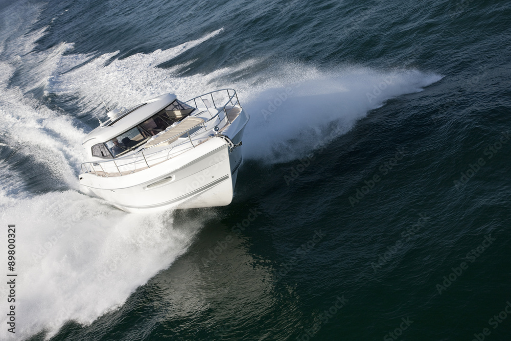 Elegant speed boat sailing through a deep ocean Stock Photo | Adobe Stock