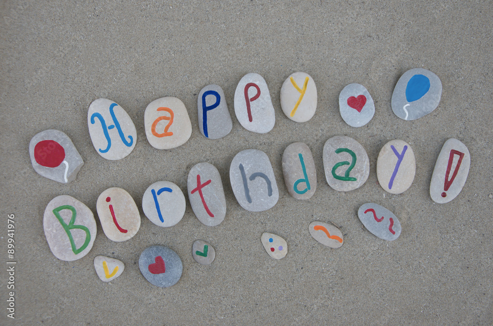 Happy Birthday on carved stone letters over the sand Stock Photo ...