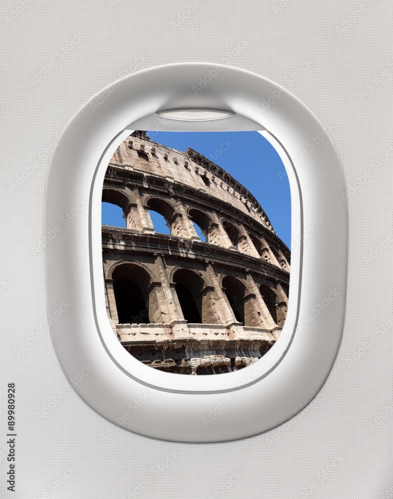 Looking out the window of a plane to the Colosseum in Rome Stock Photo ...