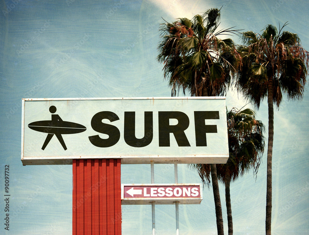 aged and worn vintage photo of surf lessons sign on beach Stock Photo ...