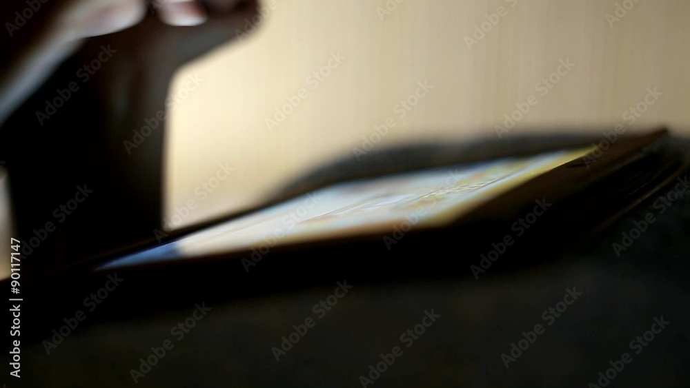 Close uo of kid hand touching screen of touch pad while playing video ...