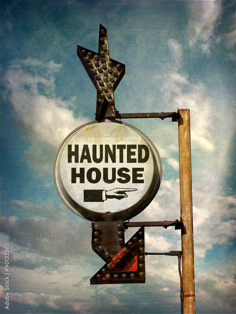 aged and worn vintage photo of haunted house sign with arrow Stock ...