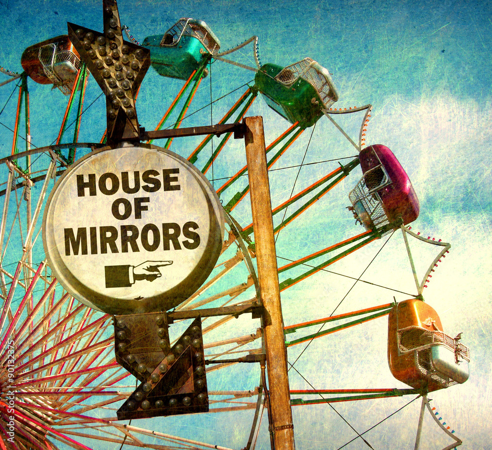 aged and worn vintage photo of house of mirrors sign at carnival Stock ...