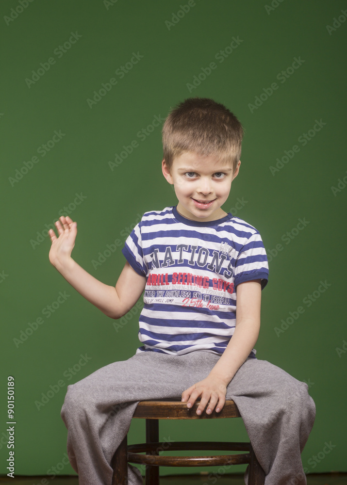 Cute boy waving hand, and smiling. Motion blur in hand wave. Gre Stock ...