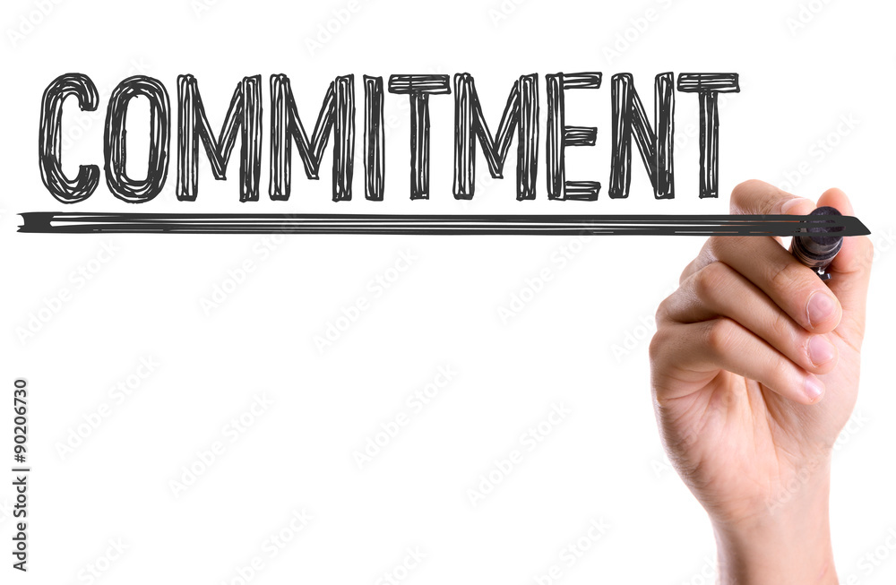 Hand with marker writing the word Commitment Stock-Foto | Adobe Stock