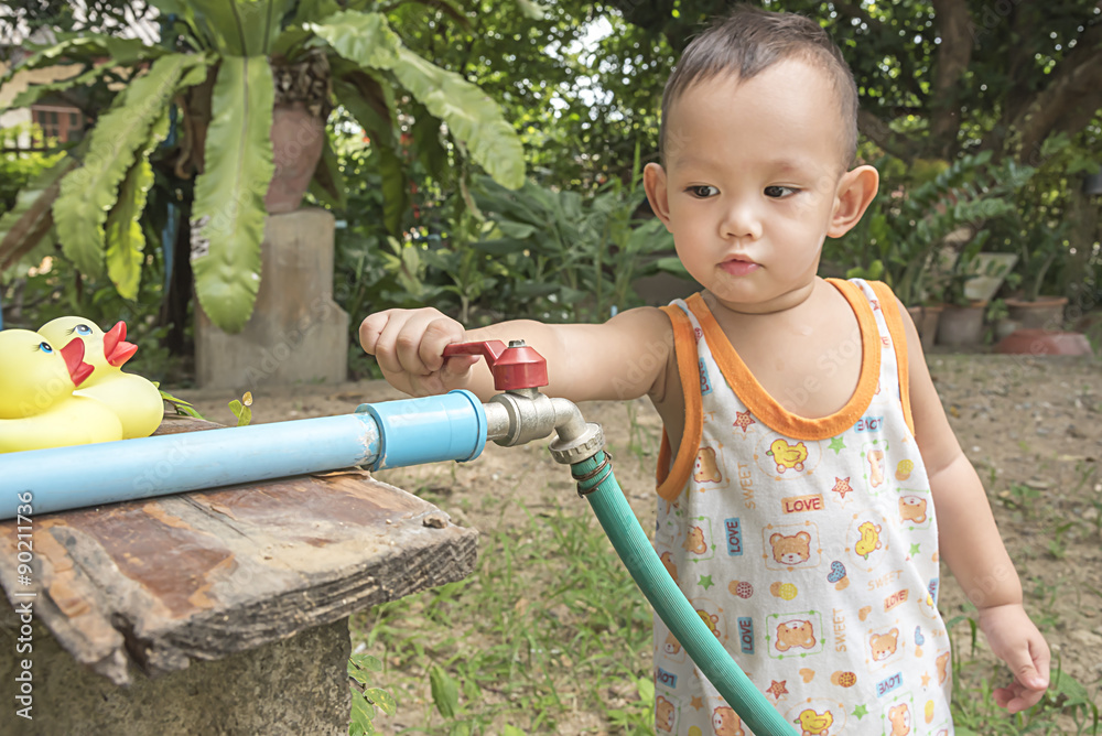 Kid using hand close faucet to turn off water Stock Photo | Adobe Stock