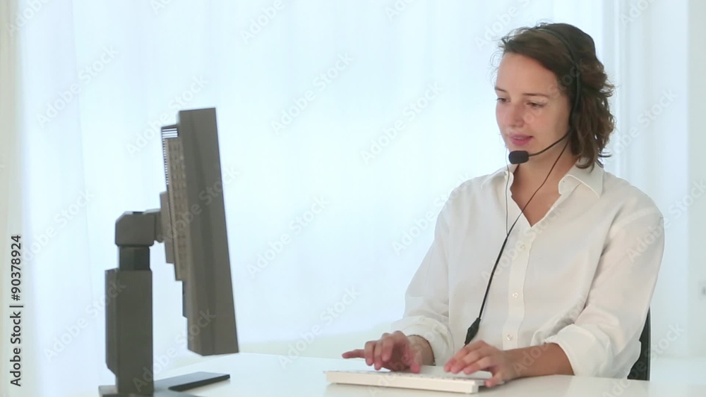 Young woman telephone operator working in front of computer Stock Video ...