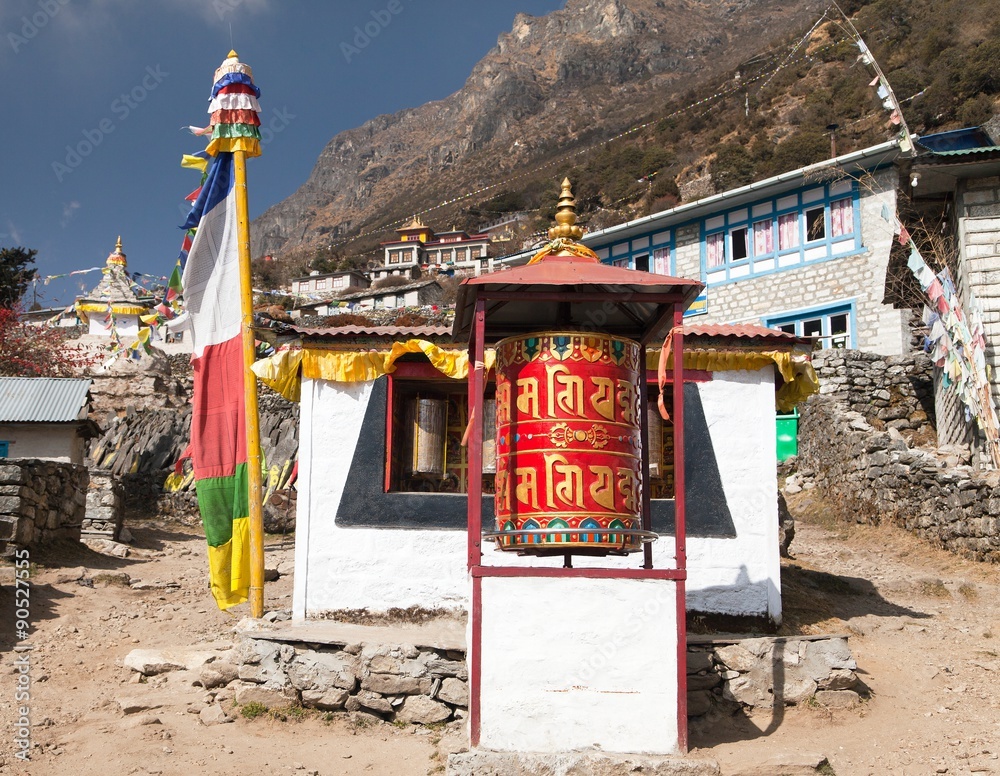 Thamo gompa with prayer flags and buddhist symbols Stock Photo | Adobe ...