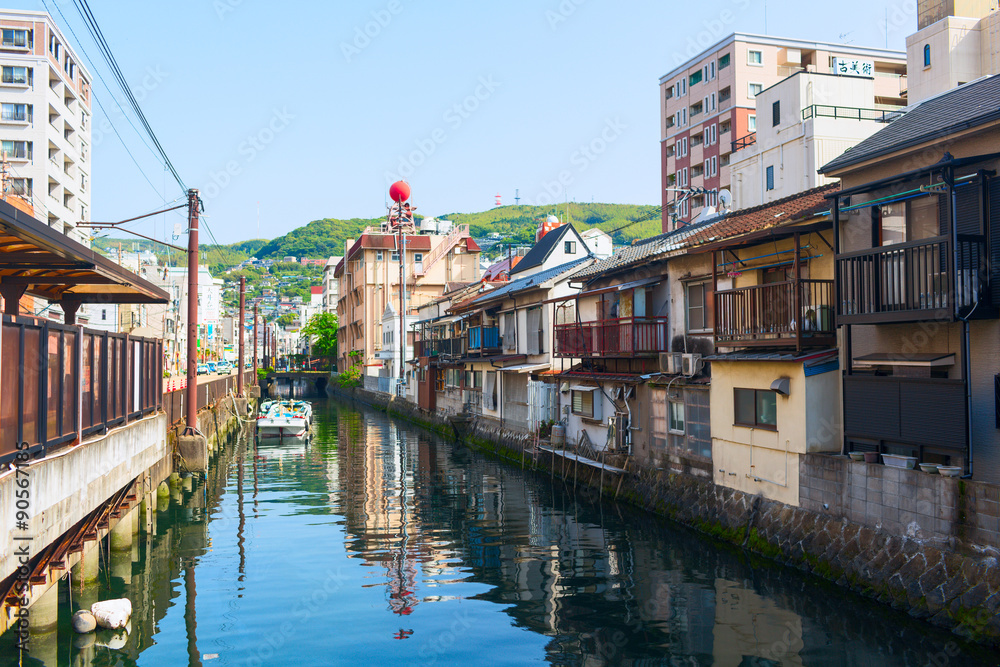 Old Town district in Nagasaki City. Artificial canal flows into the ...