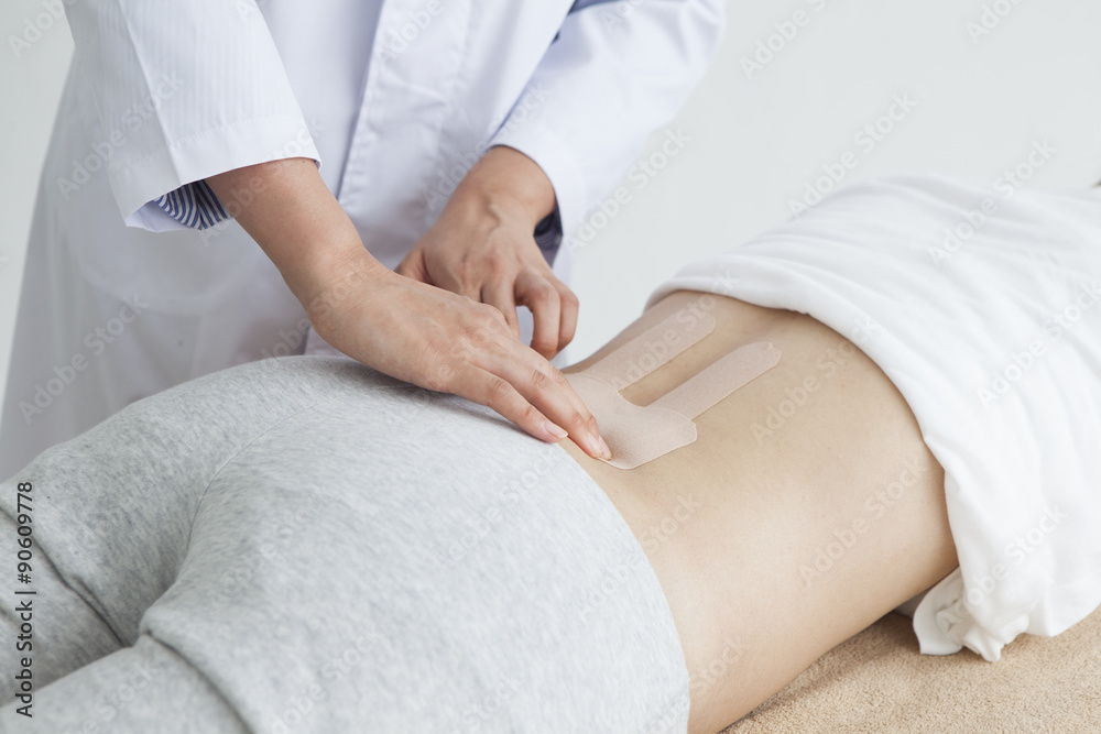 Women who have been stuck back pain of taping in orthopedics Stock ...