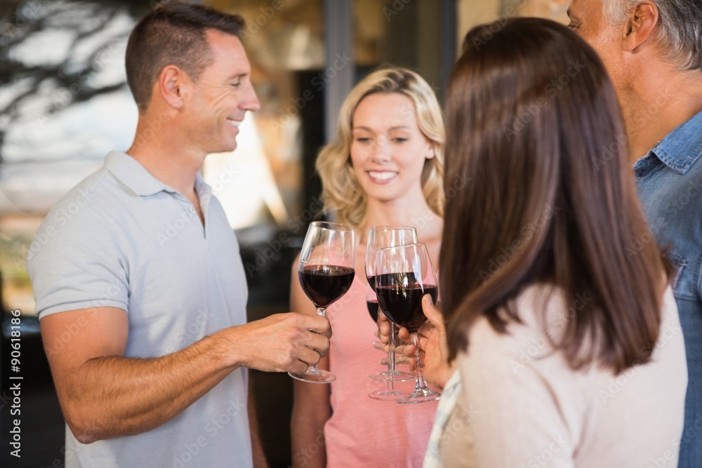 Happy friends in a wine tasting having wine Stock-Foto | Adobe Stock