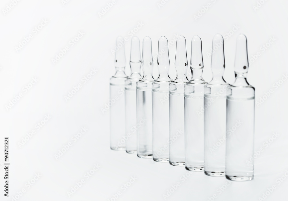 Break-seal glass ampoule set with liquid medicine on white background ...