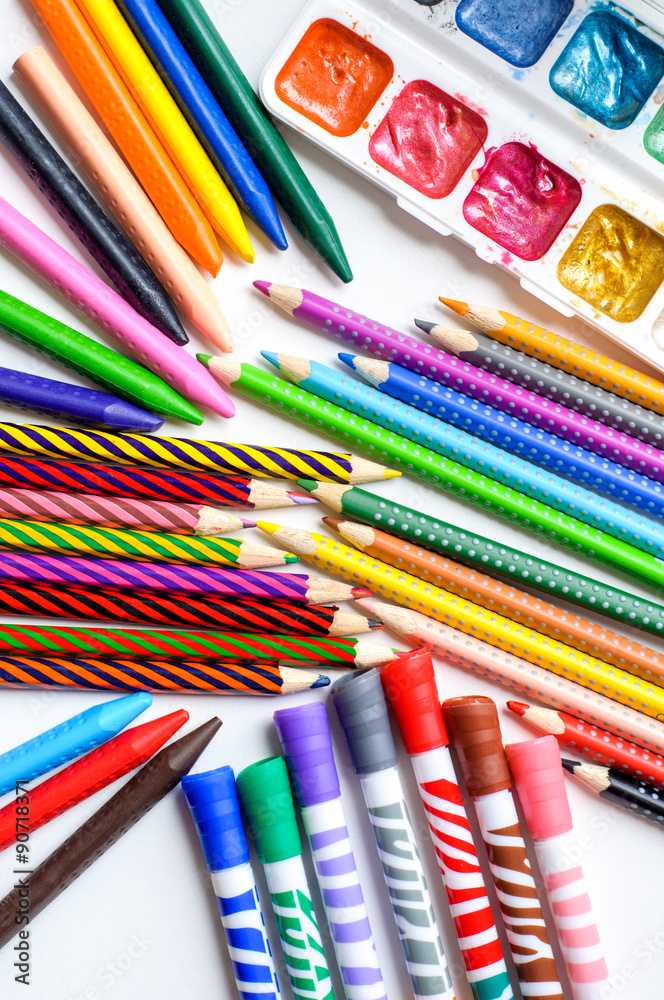 Colored pencils, crayons, markers and paints on white background Stock ...