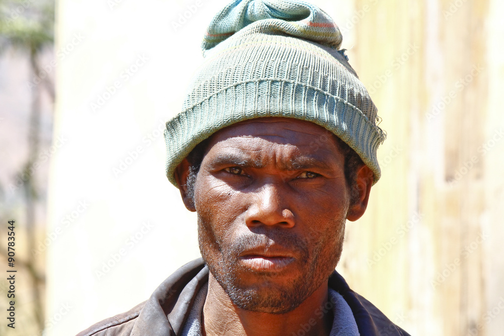 Poor black South African man holding his hat Stock Photo | Adobe Stock