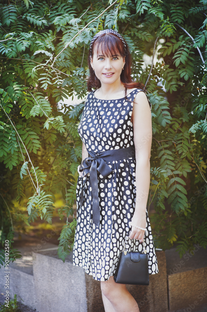 Beautiful woman in retro style dress Stock Photo | Adobe Stock