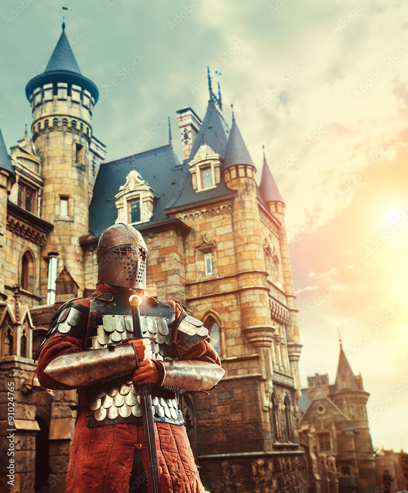 Medieval knight with the sword on the ancient castle background Stock ...