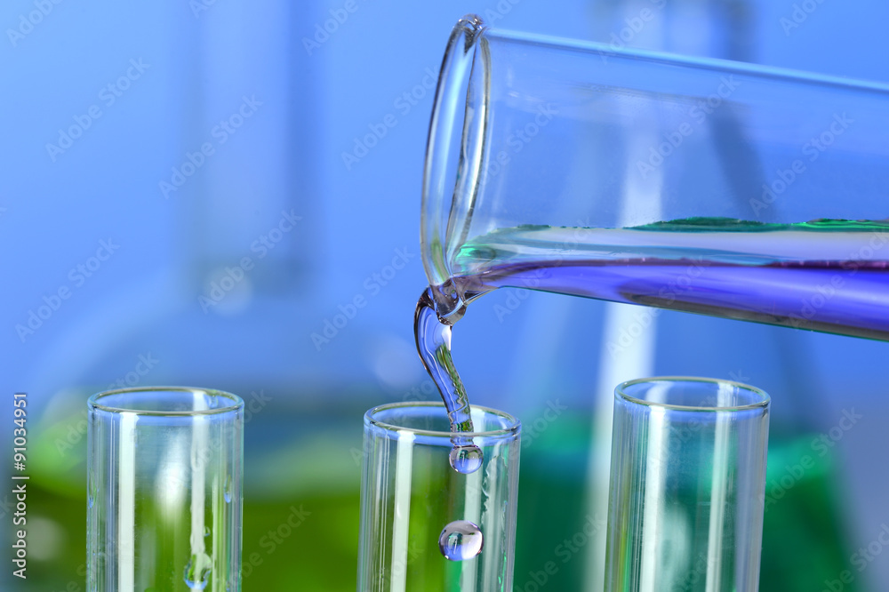 Liquid Pouring into Test Tube Stock-Foto | Adobe Stock