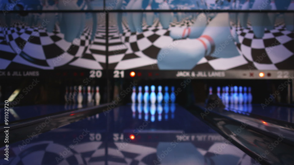 camera following the flight of a bowling ball down a bowling lane ...