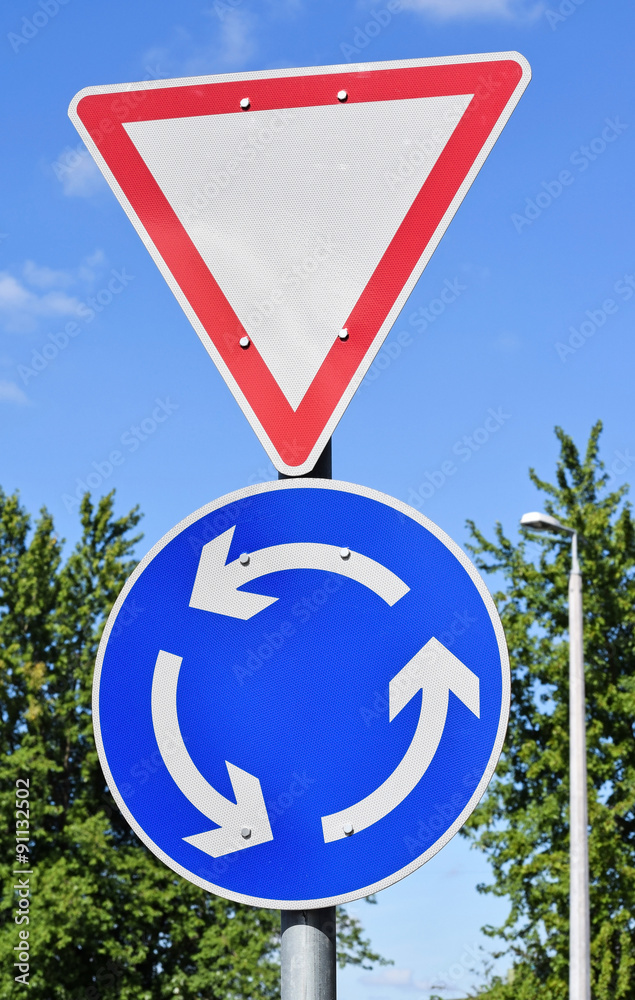 Yield and roundabout signs Stock Photo | Adobe Stock