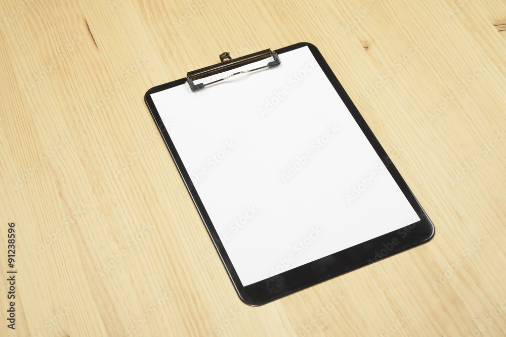 Tabla portadocumentos sobre fondo de madera Stock Photo | Adobe Stock