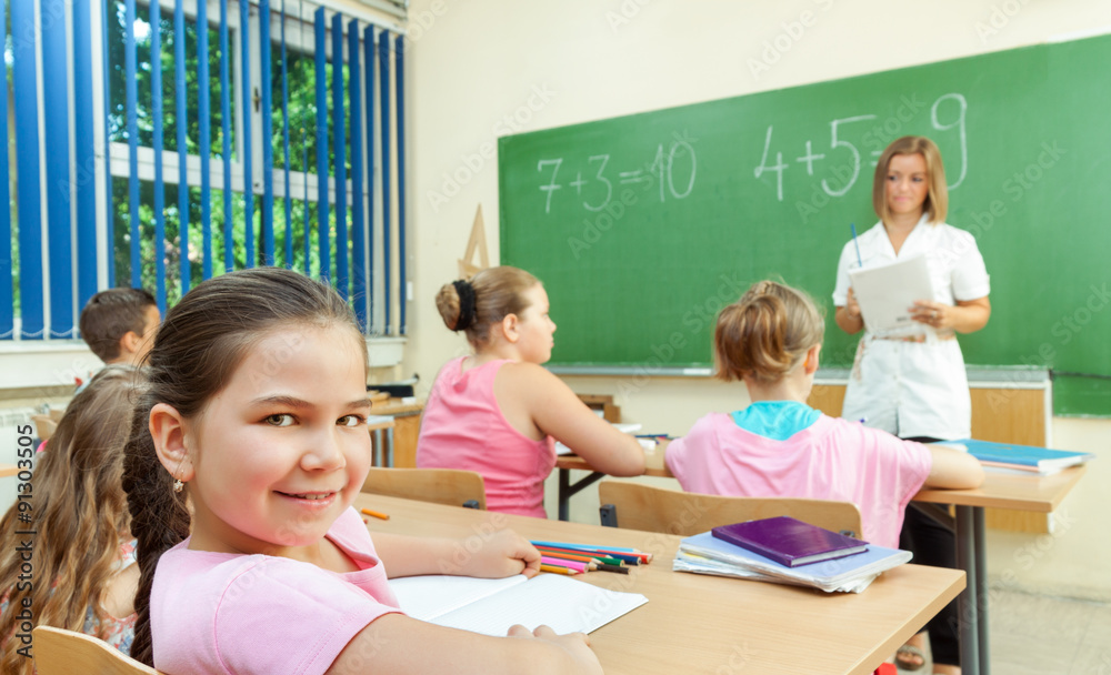 Elementary School Students at Classroom Desks Stock Photo | Adobe Stock
