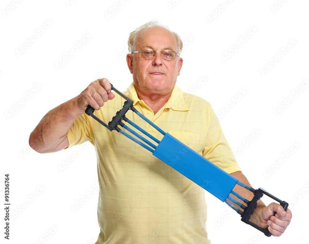 Elderly man with chest expander. Stock-Foto | Adobe Stock