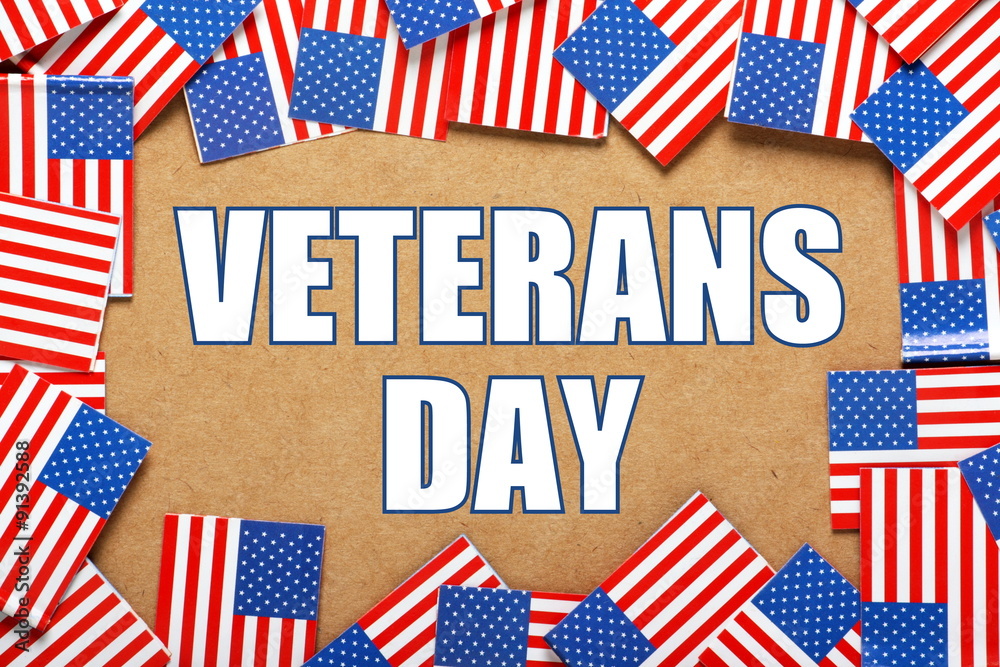 The phrase Veterans Day in block letters on a paper background ...