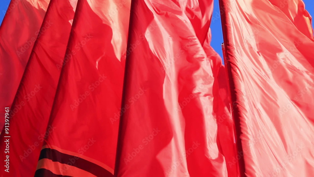 Decorative red flags waving in wind Stock Video | Adobe Stock