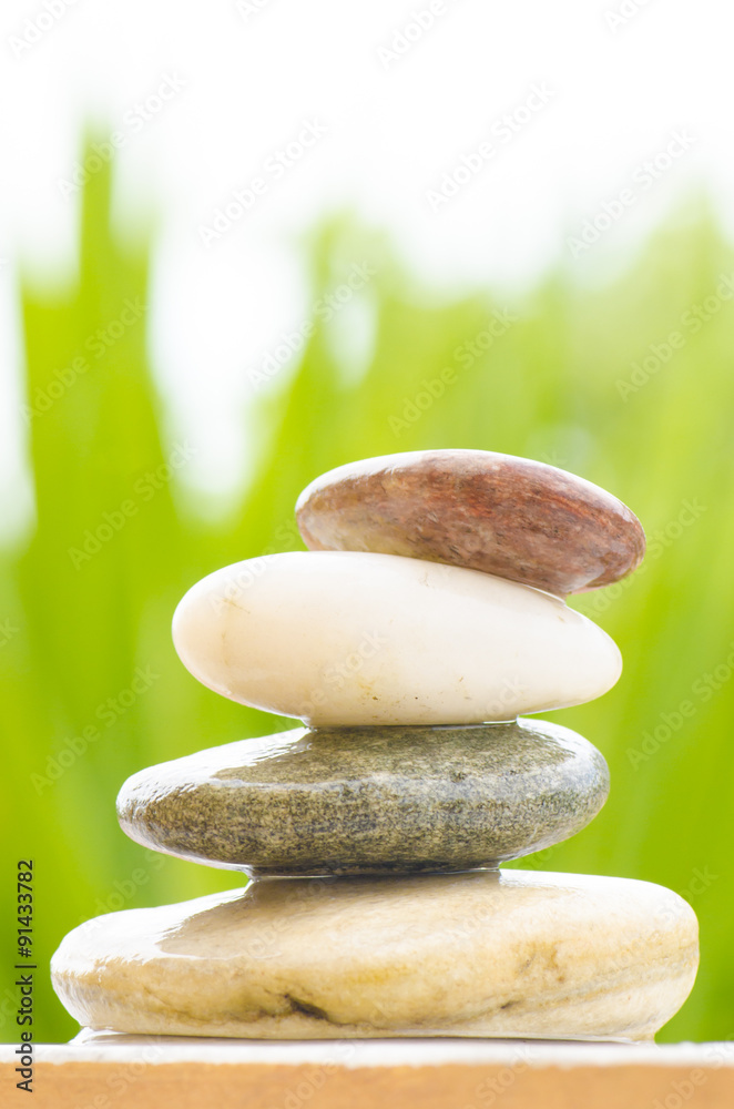 Stack of 4 rocks pyramid of different colors Stock Photo | Adobe Stock