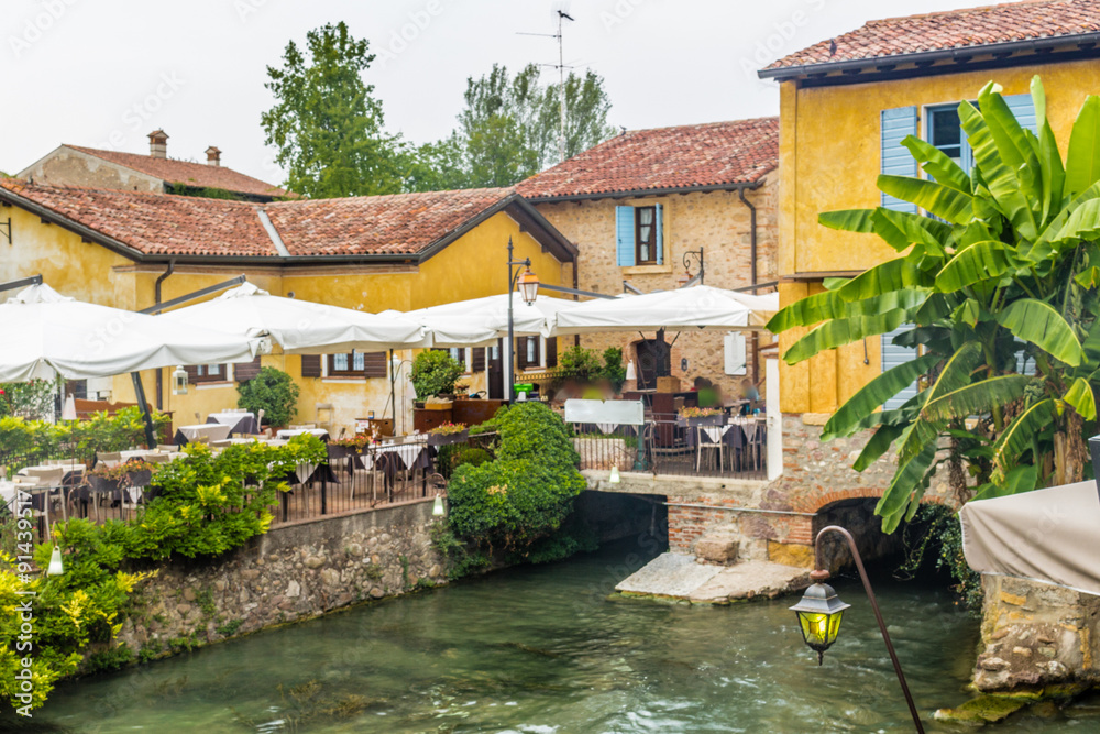 Waters and ancient restaurant of Italian medieval village Stock Photo ...