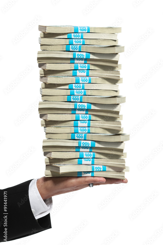 Hand of a business man holding a tall stack of money Stock Photo ...