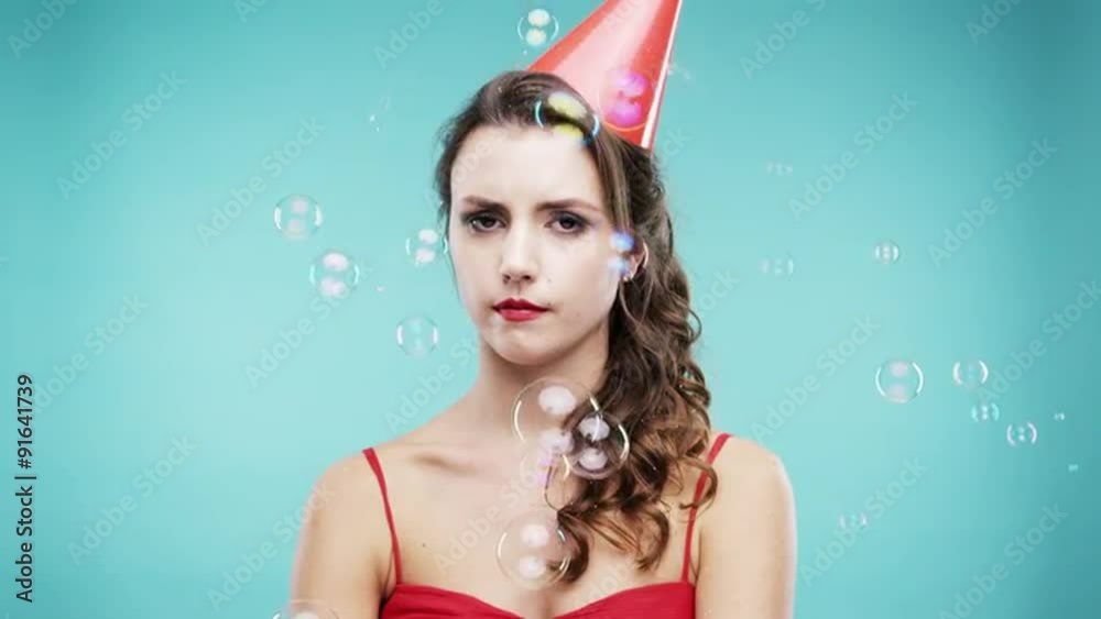 Single woman is sad in bubble shower slow motion photo booth blue ...