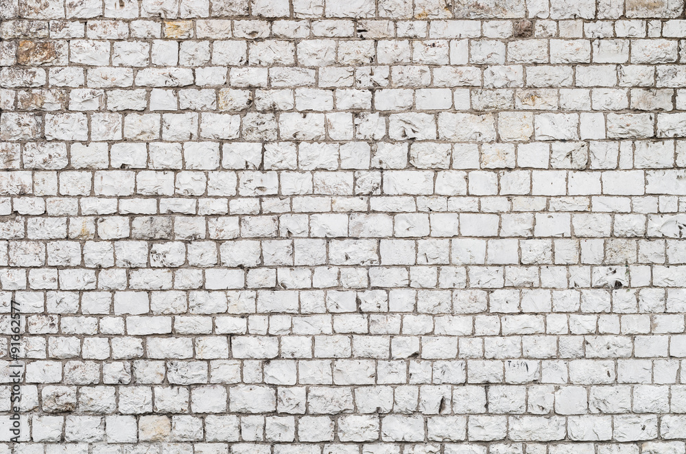 Old romanesque wall made of small limestone bricks Stock Photo | Adobe ...