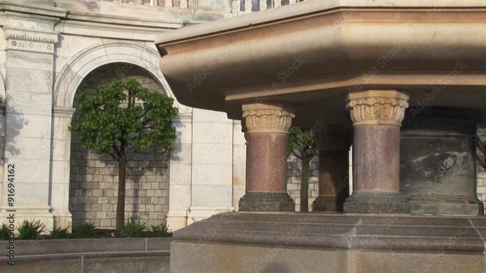 The camera pans up the facade of the U.S. Capitol building, from the ...